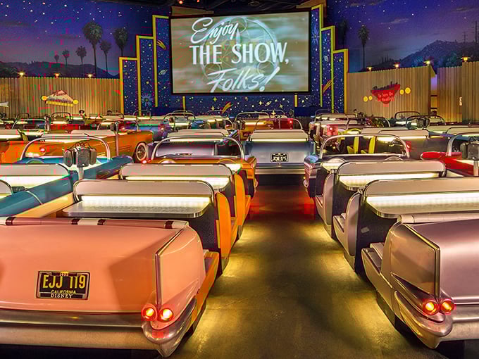 The entrance sets the stage perfectly&mdash;a vintage convertible parked beneath a retro marquee that promises cinematic dining adventures ahead.
