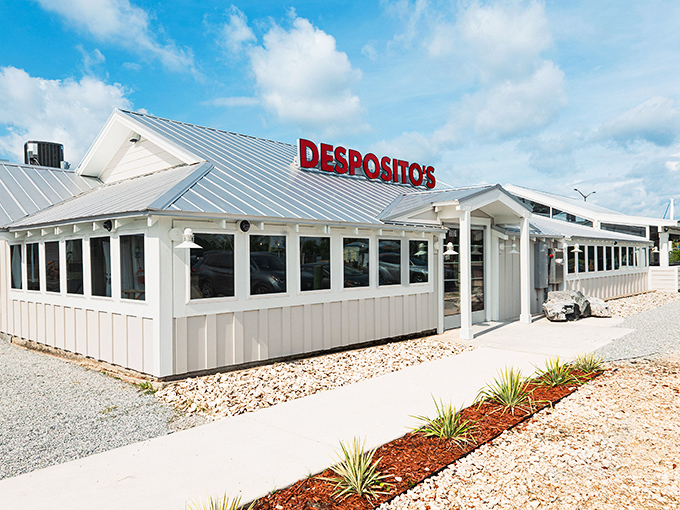 The unassuming white building with that bold red sign might fool you, but locals know&mdash;seafood paradise awaits inside this coastal gem.