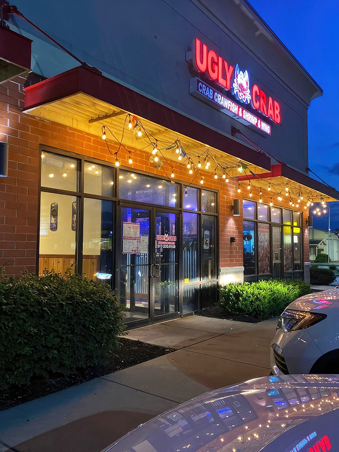 Ugly Crab stands proudly in a strip mall sanctuary, proving that seafood paradise can exist between a Thai restaurant and a parking lot.