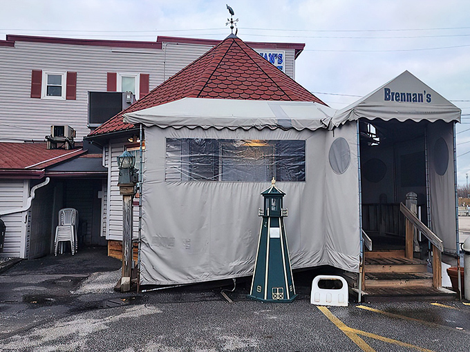 The iconic red-roofed entrance to Brennan's Fish House stands like a lighthouse beacon for hungry travelers. Seafood salvation awaits inside.