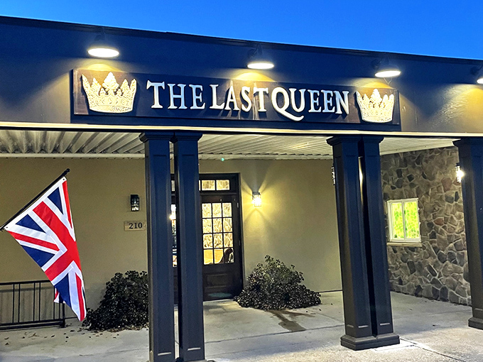 The Last Queen stands proudly in Enon, its stone facade and British flag promising an authentic pub experience that feels worlds away from Ohio cornfields.