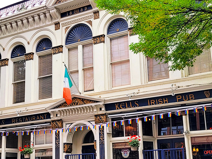 The historic fa&ccedil;ade of Kells stands proudly in Portland, complete with Irish flag and inviting blue umbrellas beckoning passersby to step into Dublin-on-the-Willamette.