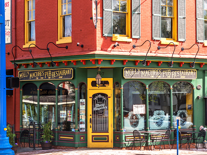 The warm brick exterior of Molly Maguire's glows at twilight, with the iconic Guinness sign promising authentic Irish hospitality within.