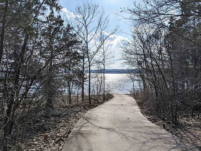 Nature's perfect balance of accessibility and beauty. A paved pathway curves gently alongside the crystalline waters of Table Rock Lake, inviting explorers of all abilities. 