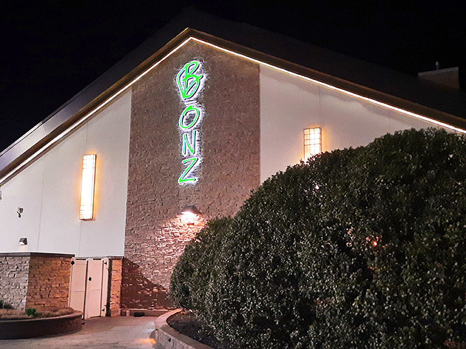 The glowing green Bonz sign beckons like a culinary lighthouse in the night, promising steak salvation amid Delaware's rural landscape.