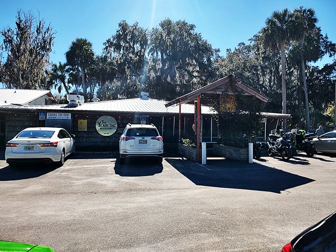 The unassuming entrance to culinary paradise. Spanish moss and Florida pines stand guard over this literary landmark that's been serving authentic flavors since 1952.