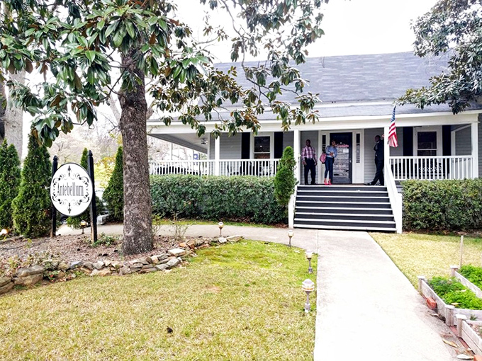 A Southern welcome if there ever was one. This charming white farmhouse with its inviting porch promises culinary magic within its historic walls. 