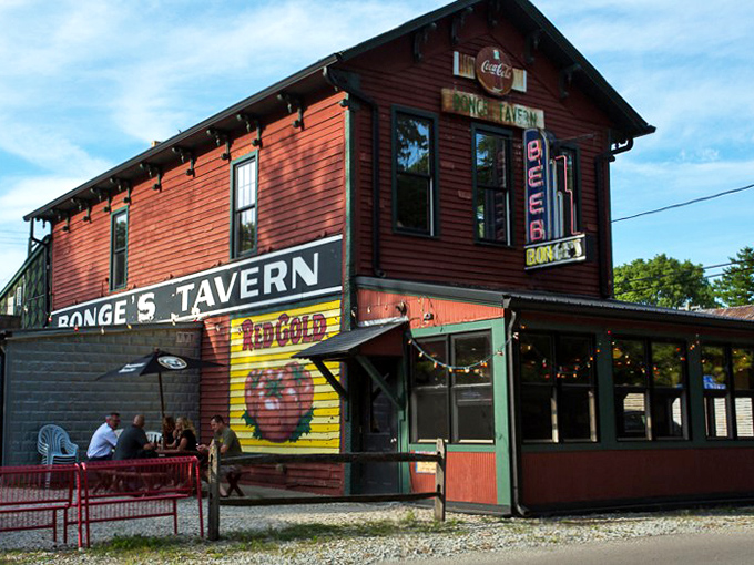The unassuming red exterior of Bonge's Tavern stands like a culinary lighthouse in rural Indiana, beckoning hungry travelers since 1934.