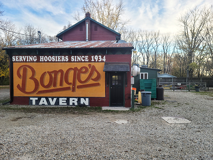 The unassuming red exterior of Bonge's Tavern stands like a culinary lighthouse in rural Indiana, beckoning hungry travelers since 1934. 