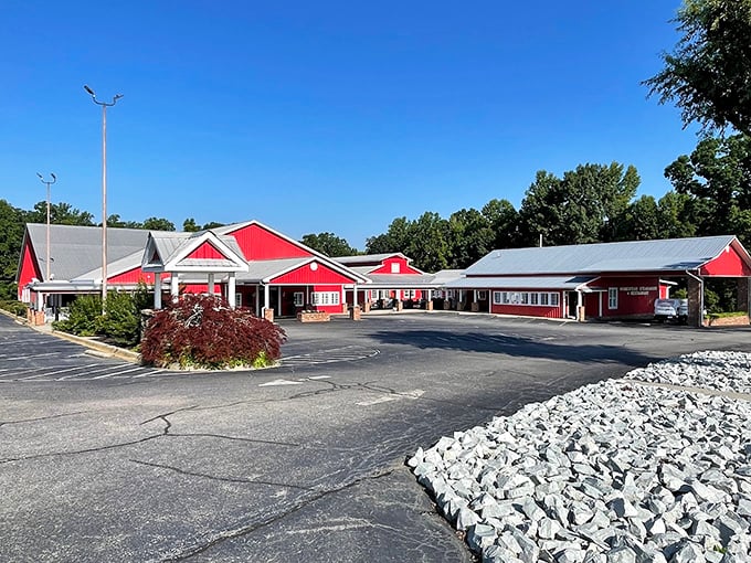 The barn-red exterior of Homestead Steakhouse stands proud against Carolina blue skies, like a beacon calling hungry travelers home.