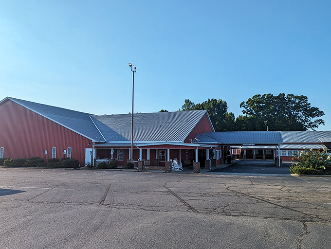 The barn-red exterior of Homestead Steakhouse stands proud against Carolina blue skies, like a beacon calling hungry travelers home.