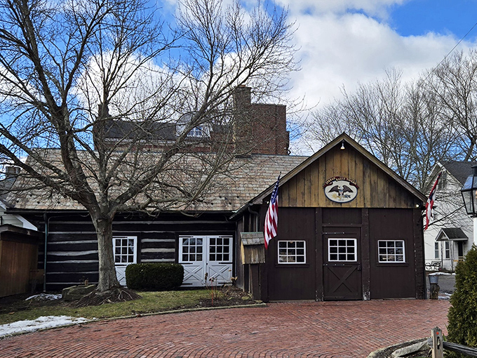 The Spread Eagle Tavern glows like a welcoming beacon in the night, its historic charm beckoning hungry travelers with promises of culinary delights within.