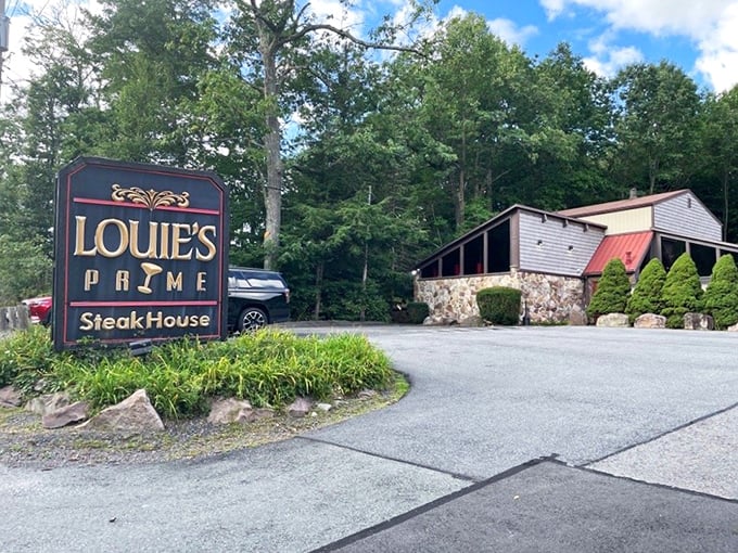 The forest parts to reveal culinary treasure &ndash; Louie's Prime Steak House stands proudly among the trees, its stone foundation and wooden charm beckoning hungry travelers.