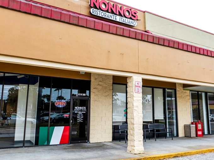 The unassuming storefront hides culinary treasures within, like finding a Ferrari parked at a strip mall. The Italian flag on the door signals authentic delights await.