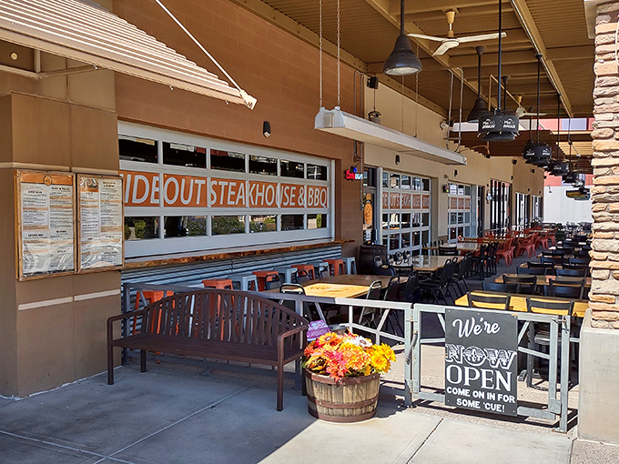 The unassuming exterior of Hideout Steakhouse & BBQ proves once again that culinary treasures often hide in plain sight. Desert dining at its finest awaits inside.