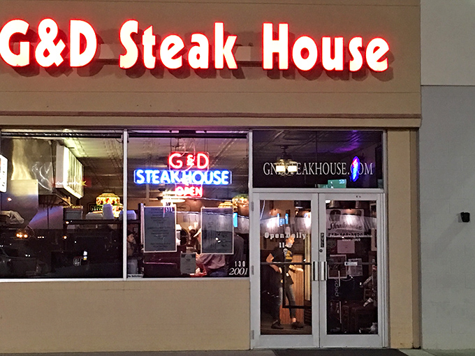 The red letters of G & D Steakhouse beckon like a beacon for beef lovers. No fancy frills, just the promise of serious steak satisfaction inside.