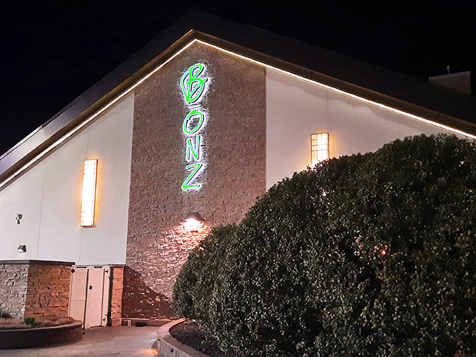 The glowing green Bonz sign beckons like a culinary lighthouse in the night, promising steak salvation amid Delaware's rural landscape.