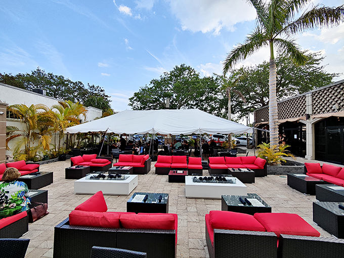 Palm trees sway gently over Ember & Oak's inviting patio, where Florida sunshine and culinary excellence meet in perfect harmony.