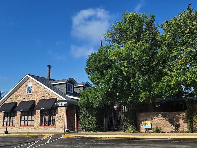 The iconic brick exterior of Tucker's Place glows with welcome in the evening light, a beacon for hungry carnivores throughout Manchester.