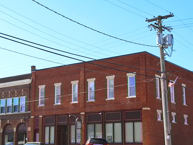 Colorful tiny shops at Down A Country Road create a garden oasis where Amish crafts find their showcase amid blooming flowers and comfortable seating areas. 