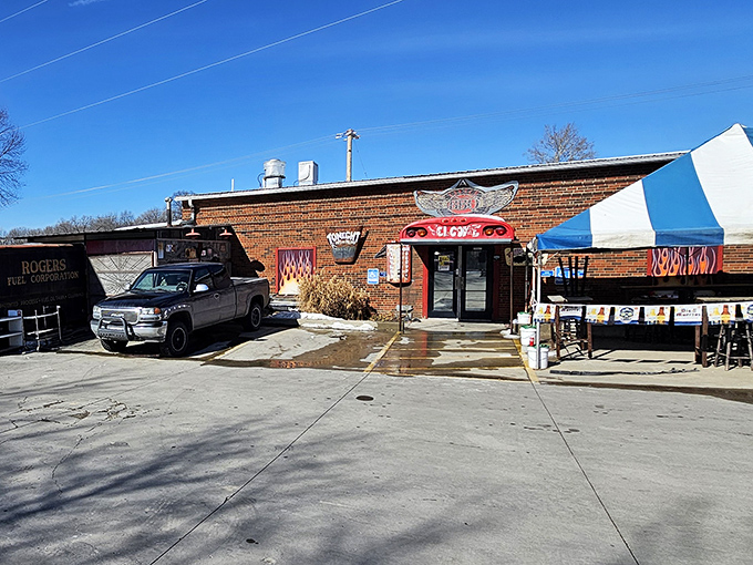 The unassuming brick exterior promises barbecue greatness with its cheeky welcome sign and flame-adorned entryway. Meat paradise awaits. 