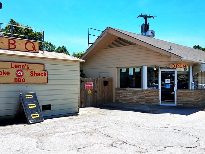 The unassuming stone facade of Leon's might not stop traffic, but that heavenly smoke billowing from the roof? That's nature's most effective billboard.