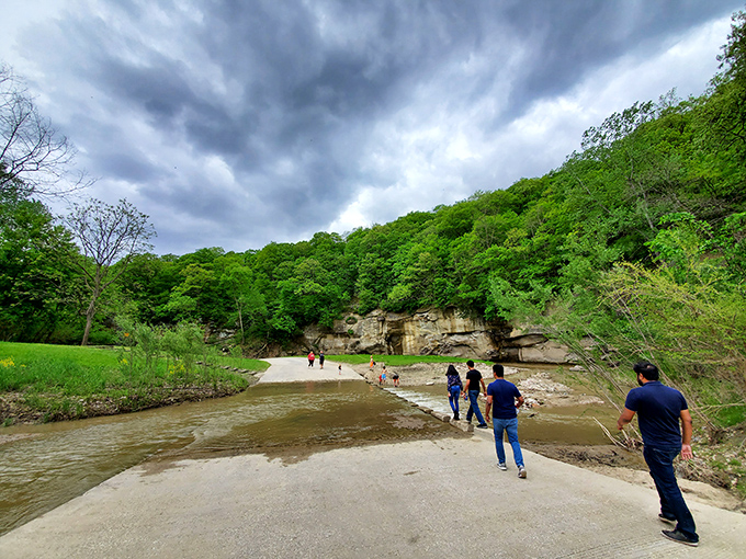 Nature's perfect mirror: sandstone cliffs reflect in the crystal-clear waters of Pea's Creek, creating Iowa's version of a double feature you don't need Netflix for.