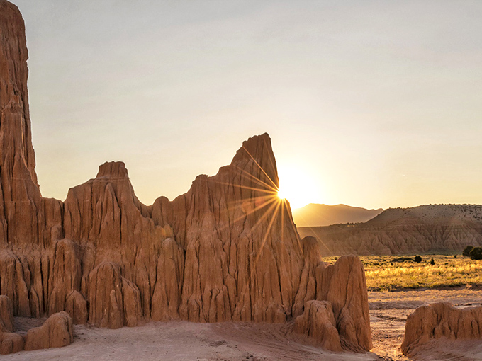 Nature's skyscraper stands proudly against Nevada's impossibly blue sky. This towering spire is what geological patience looks like after a few million years.