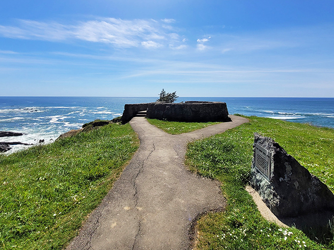 The welcoming entrance to Shore Acres State Park, where towering evergreens stand guard over one of Oregon's best-kept coastal secrets.