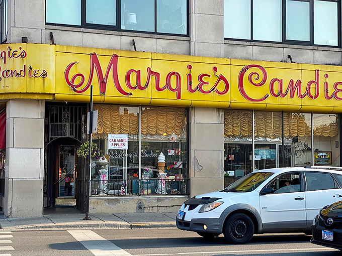 That iconic yellow and red sign beckons like a lighthouse for sweet-toothed sailors navigating the urban seas of Chicago's neighborhoods.