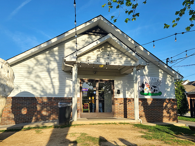 The unassuming white building with string lights and a cow logo promises more joy than most five-star restaurants I've visited.