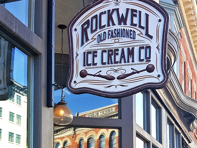 The storefront beckons like an ice cream oasis in downtown Provo, with mountains framing this temple of frozen delights.