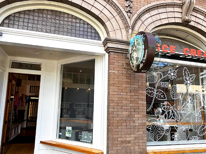 The architectural equivalent of "come hither" &ndash; Molly Moon's storefront beckons with its classic brick fa&ccedil;ade and neon glow, promising sweet relief from Seattle's bustling streets. 