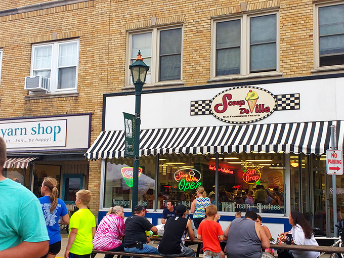 The classic checkered facade of Scoop De Ville stands like a time portal to simpler days when ice cream was the ultimate problem solver.
