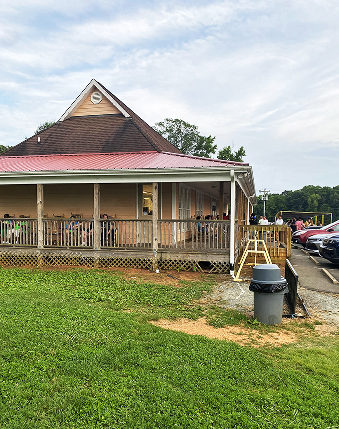 The iconic cow with a red cap stands guard atop this charming country store, promising dairy delights that are worth every mile of the journey.