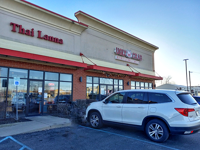 Ugly Crab stands proudly in a strip mall sanctuary, proving that seafood paradise can exist between a Thai restaurant and a parking lot.