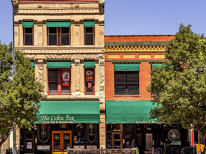 The Celtic Fox's emerald-green awnings stand out like a beacon of Irish hospitality on Topeka's historic downtown strip. Architecture that whispers "come in for a pint."