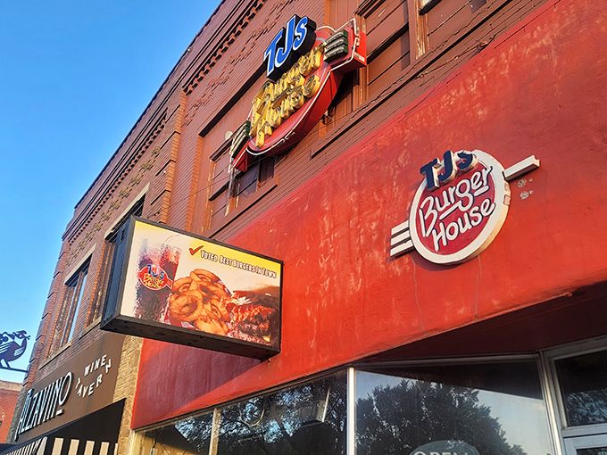 That iconic yellow and red sign against classic brick isn't just restaurant signage&mdash;it's a beacon of burger hope for hungry Kansans everywhere.