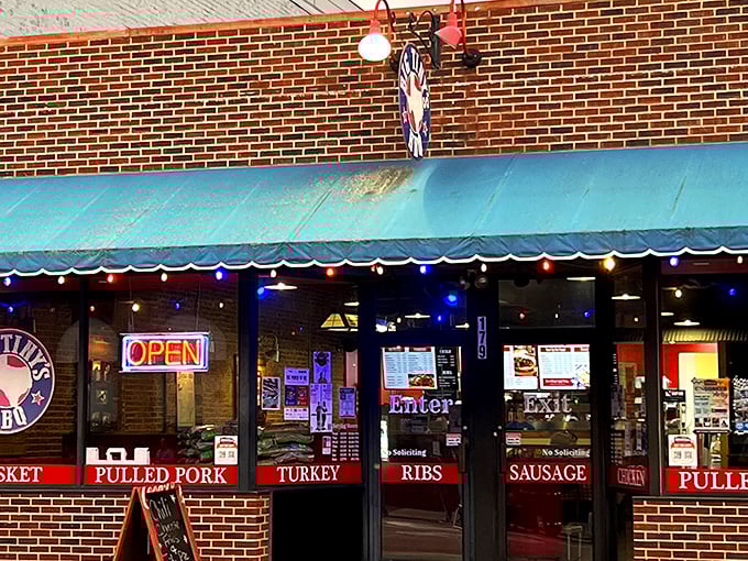 The neon "OPEN" sign at Big Tiny's isn't just an invitation&mdash;it's a siren call to barbecue pilgrims. Those colorful string lights aren't decorations; they're beacons of smoked meat salvation.