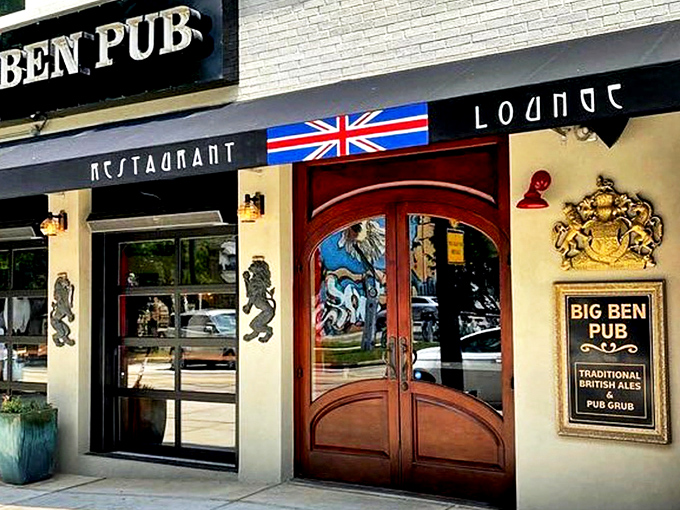 The Union Jack proudly announces your arrival at Big Ben Pub, where those magnificent wooden doors might as well be a portal straight to London.