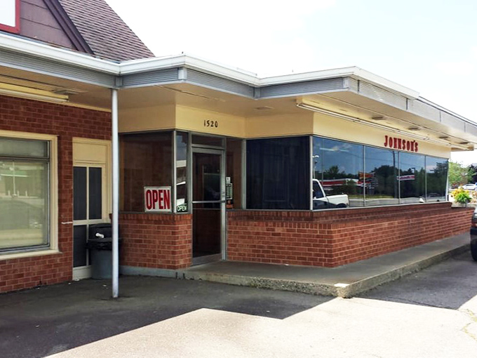 The unassuming exterior of Johnson's Drive-In has welcomed burger enthusiasts since 1946, proving that culinary landmarks don't need flashy facades to become legendary.