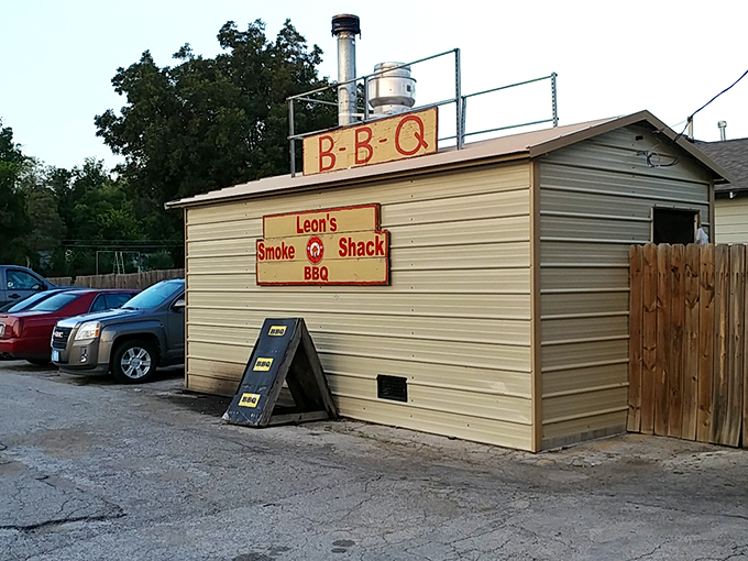 The unassuming stone facade of Leon's might not stop traffic, but that heavenly smoke billowing from the roof? That's nature's most effective billboard.
