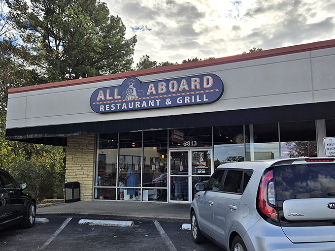 The blue locomotive sign beckons hungry travelers like a friendly conductor. All Aboard's unassuming strip mall location hides a culinary journey worth taking.