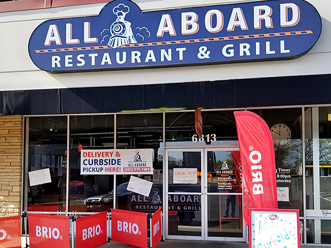 The blue locomotive sign beckons hungry travelers like a friendly conductor. All Aboard's unassuming strip mall location hides a culinary journey worth taking.