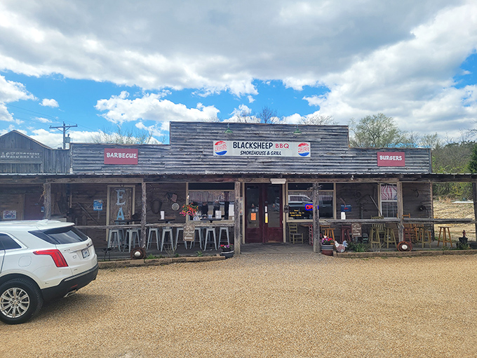 The weathered wooden exterior of Blacksheep BBQ isn't trying to impress anyone&mdash;until that hickory aroma hits you and changes everything.