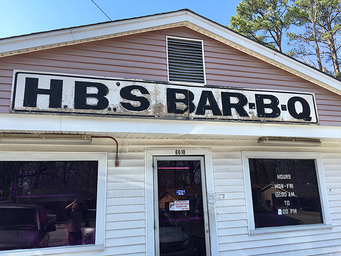 The unassuming white clapboard exterior of H.B.'s Bar-B-Q stands like a beacon to barbecue pilgrims. No fancy frills, just smoke signals of deliciousness within.