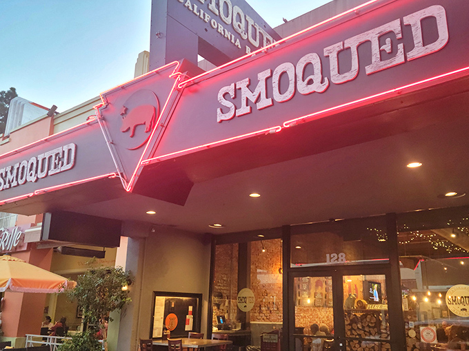 The pink pig silhouette perched atop Smoqued's sign isn't just cute &ndash; it's a beacon of hope for BBQ lovers wandering the California desert of mediocre meat.