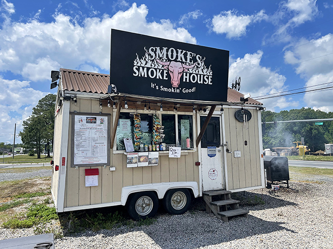 The humble chariot of smoke and glory. Smoke's Smokehouse trailer sits unassumingly in Newark, promising barbecue treasures that far exceed its modest appearance.