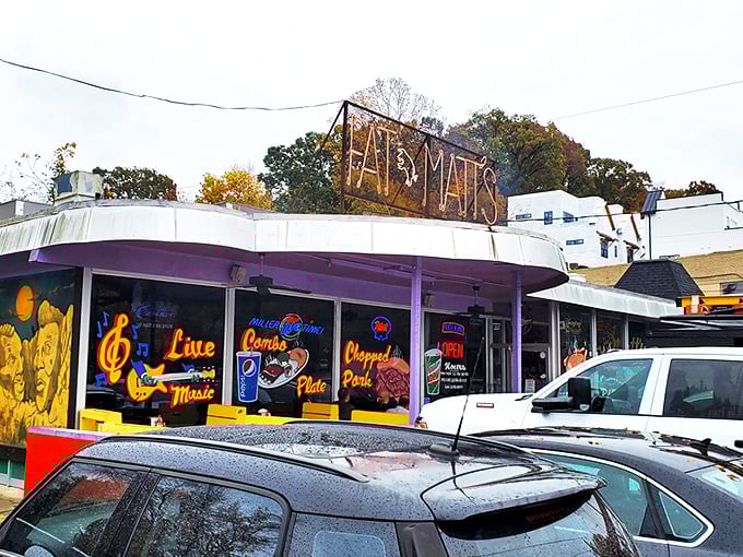 The iconic purple and red exterior of Fat Matt's stands like a BBQ beacon on Piedmont Avenue. Those neon signs aren't lying about what awaits inside.