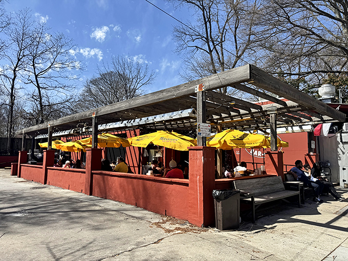 The unassuming red exterior of Fox Bros Bar-B-Q hides culinary greatness like Clark Kent's glasses hide Superman.